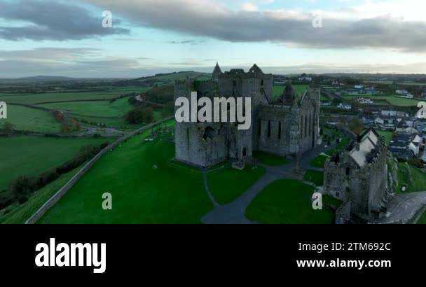 Irish cliff top castle from the air: Castle Cashel on a high stony ...