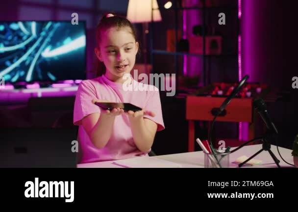 Kid content creator filming technology review of newly released ...