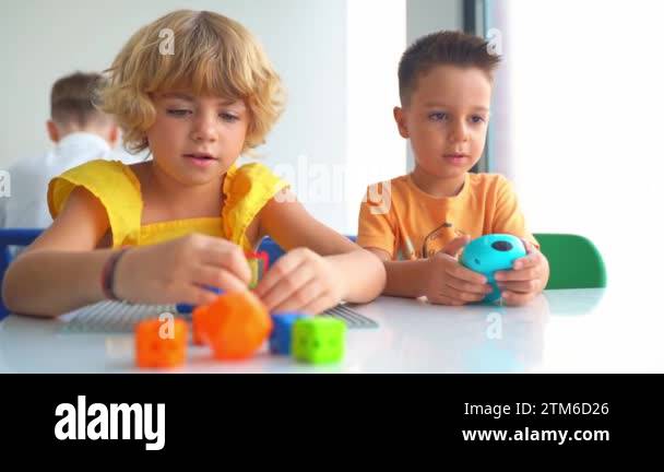 Children playing with toy car control panel in STEM educational class ...