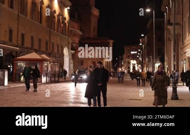 Ferrara, italy 11 april 2023: A young couple walks through the lively ...