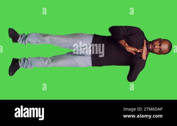 Vertical video: Front view of young model showing timeout symbol in ...