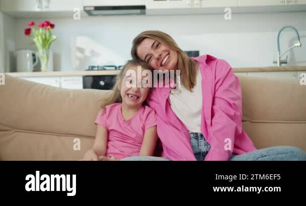 Toothless Adventure: Mother and Daughter at Home at the sofa Stock ...