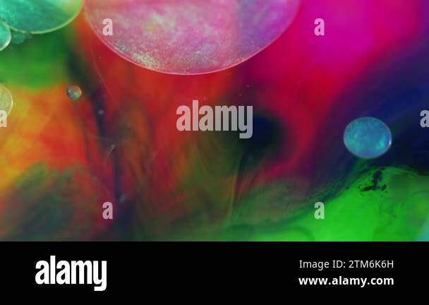 Glitter bubbles. Color mist. Paint water. Defocused bright pink green ...