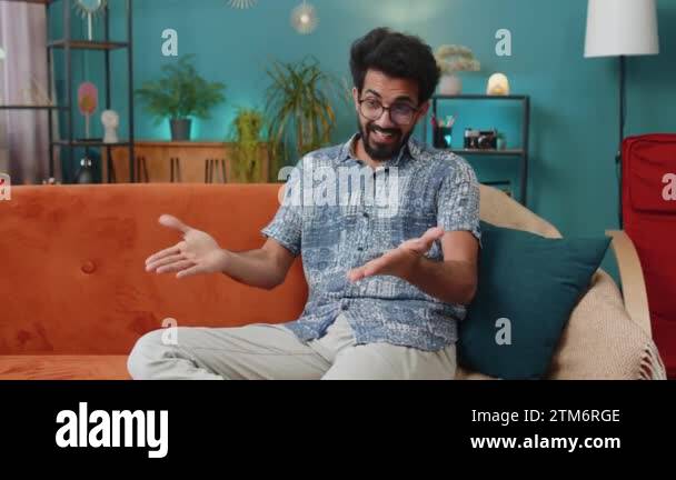 Indian man raising hands asking what why reason of failure, disbelief ...