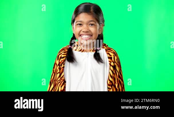 Green screen, smile and excited child in a tiger costume feeling happy ...
