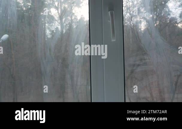 Washing windows at home. Preparation for washing. Dirty double-glazed ...