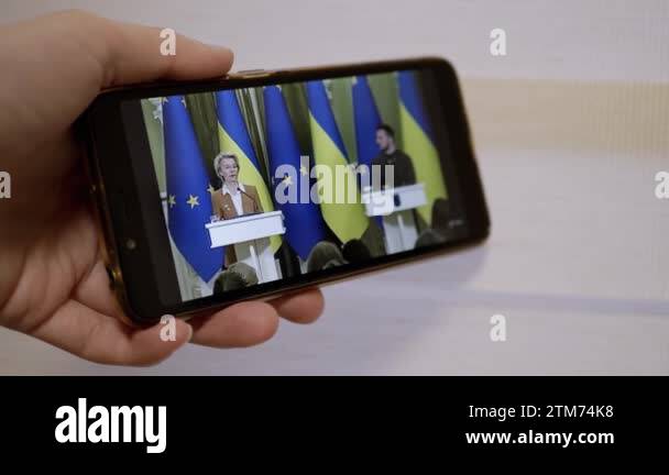 UKRAINE, KAMENSKOE, FEBRUARY, 2023: Woman Watches Speech of President ...