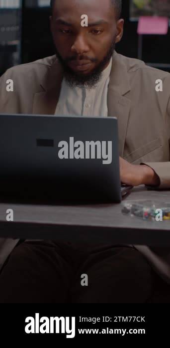 Vertical video: Professional inspector studying crime scene clues ...