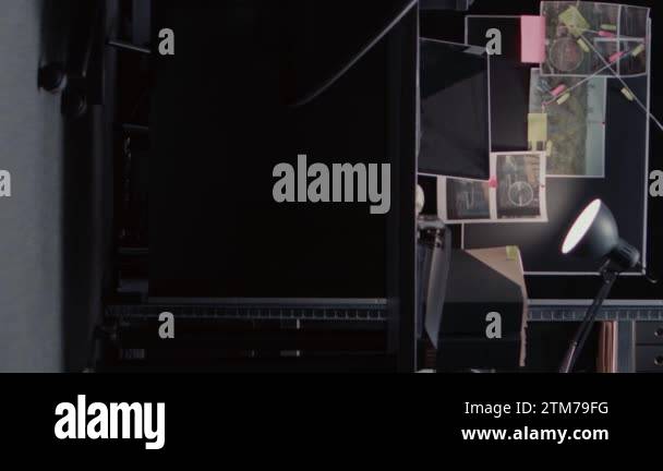 Vertical video: Empty evidence room equipped with detective map and ...