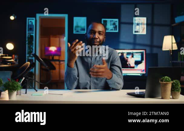 Influencer in home studio using professional camera and microphone to ...