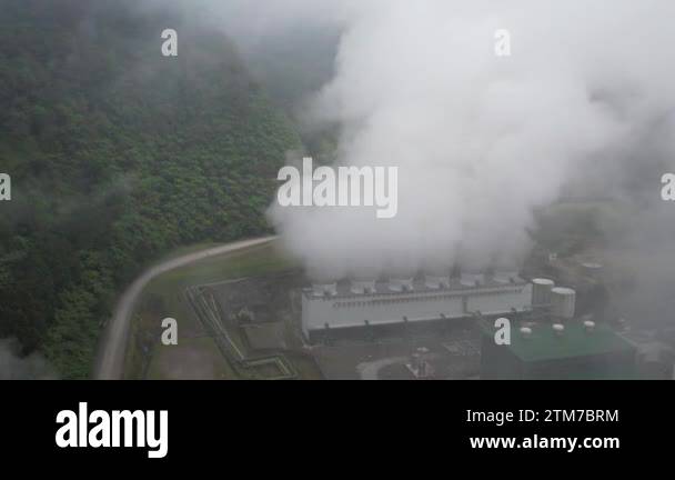 Thermal power plant on a volcano in the middle of the jungle, steam ...