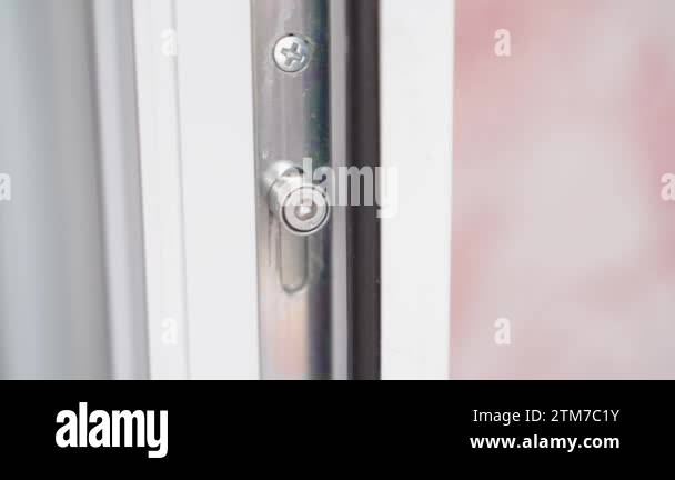 Movable mechanisms of a plastic door close-up. Switching the ...