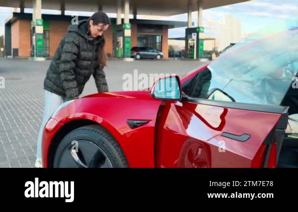 CHISINAU, MOLDOVA - MARCH, 2023: Close view of a woman closes the hood ...
