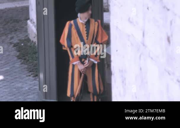Swiss Guard, with their distinctive uniforms, diligently guard a ...