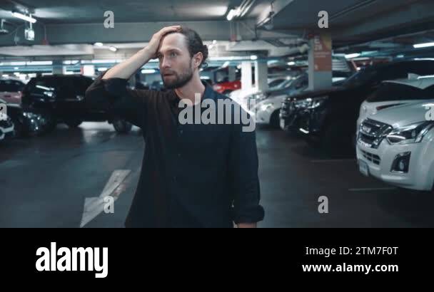 Man located in parking any problems. His facial expression indicates ...