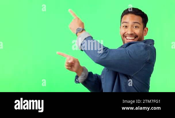 Asian man, pointing and dancing on green screen in product placement or ...