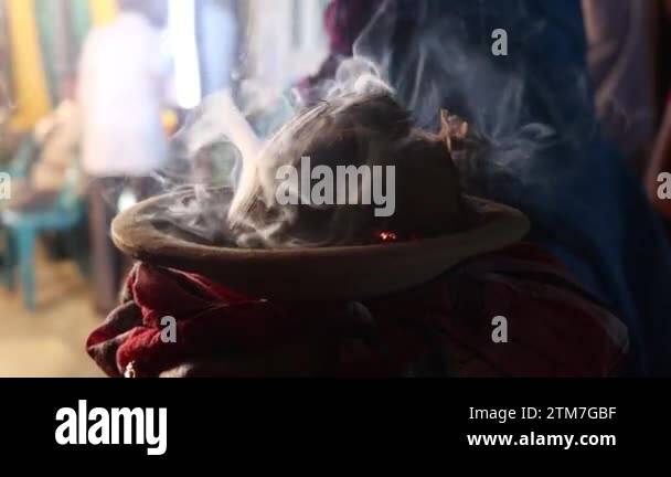 Traditional Hindu Dhunuchi footage with a lot of smoke. Holy worship ...