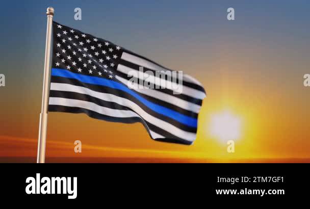 Police Flag, American Flag waving on a flagpole against the sunset ...