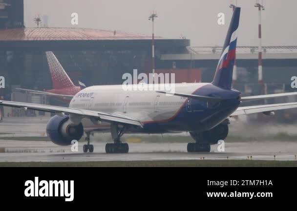 MOSCOW, RUSSIAN FEDERATION - JULY 30, 2021: Airplane, terminal ...