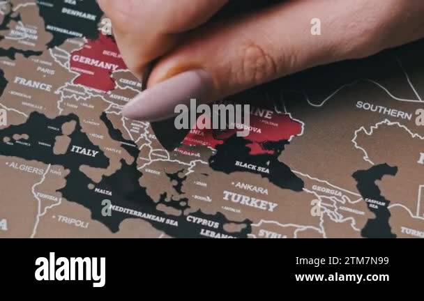 Female Hand Scratching Europe countries on the Surface of Scratch World ...