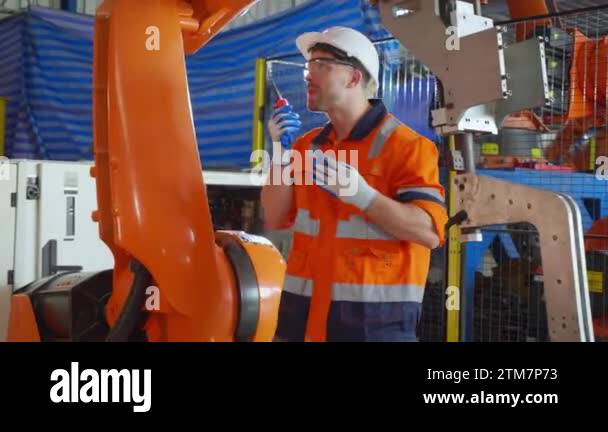 Young caucasian engineer man inspection robot arms technology ...