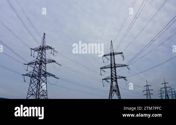 High electric pylons on sky background. Transmission lines. Electric ...