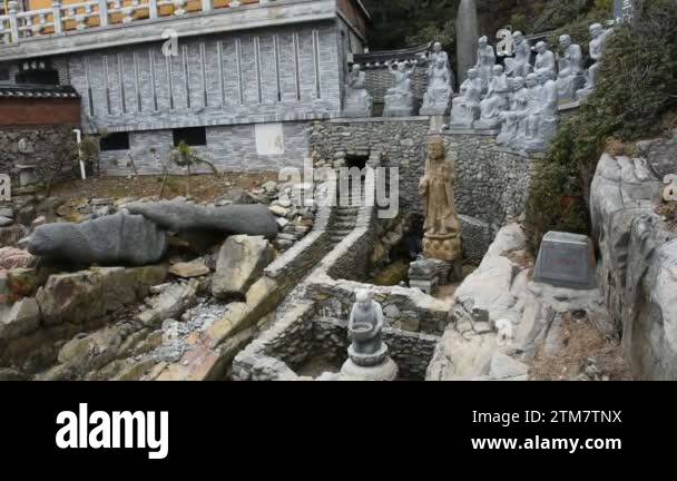 Buddha and deity angel statue in wishing pond for korean people ...
