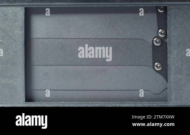 Actuation of the shutter mechanism of an old film camera inside the ...