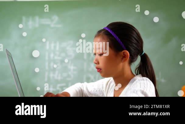 Animation of floating dots asian girl typing on keyboard of laptop ...