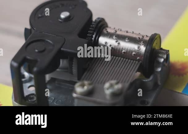 Music box mechanism close-up. Old music box clockwork device on ...