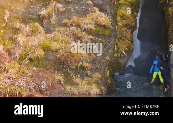 Gljufrabui, Iceland - 15th march, 2023: tourist reach in wet conditions ...