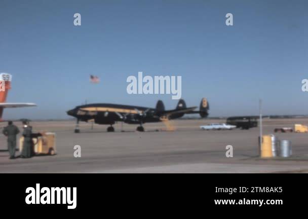 Passenger Airplane of 1950s Parked in Military Air Base with US Flag ...