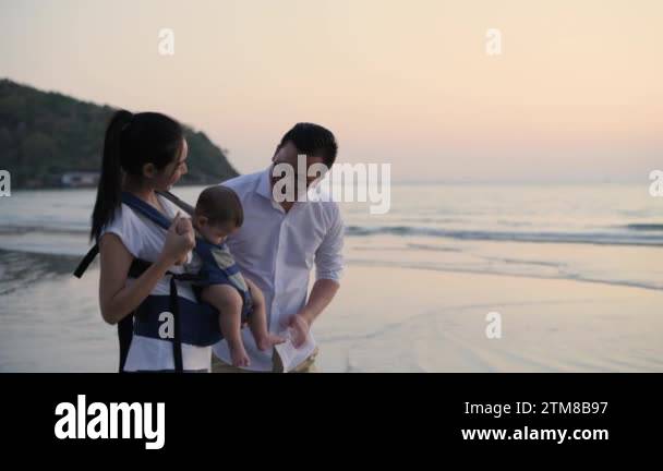 Tourism concepts of 4k Resolution. Asian family walking together by the beach Stock Video ...