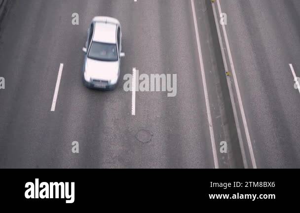 Top view of the road with cars. Many cars are driving along the road ...