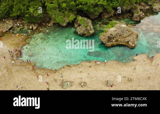 Tropical beach with natural rock pools. Magpupungko natural rock pools ...