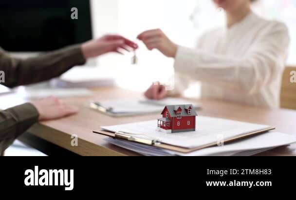Successful business deal real estate agent and new homeowner exchange ...
