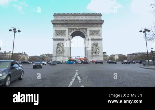 Double-decker bus passing Arc de Triomphe, tourists viewing places of ...