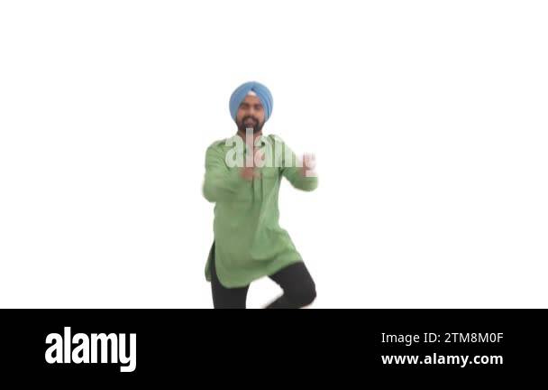 Young beard Indian man performing traditional dance mp4ement in ...