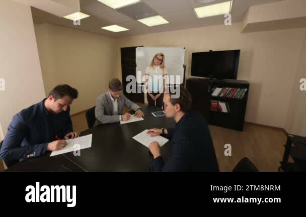 Signing a contract with a team of partners in the meeting room Stock ...