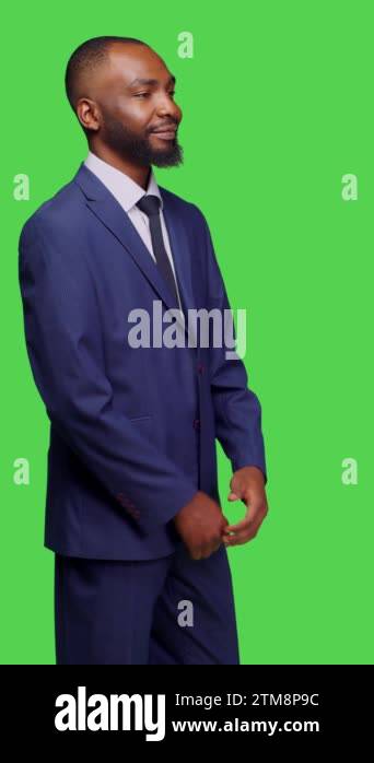 Vertical video: Side view of corporate employee wearing business suit ...