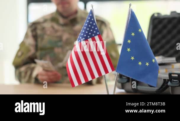 Military man counting money at table with eu and usa flags closeup 4k ...