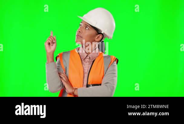 Face, serious woman and engineer pointing up, green screen or ...
