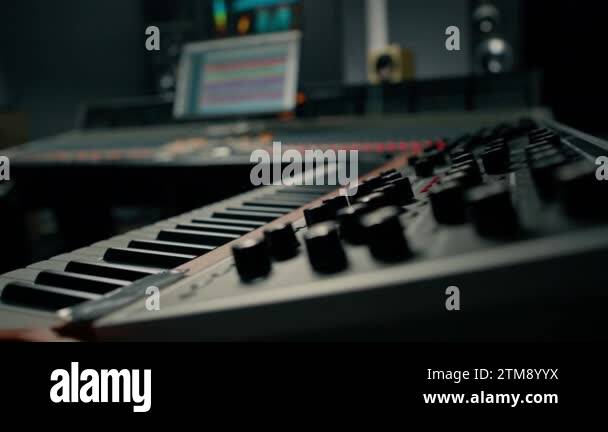 recording studio with a screen with sound wave and volume settings two ...