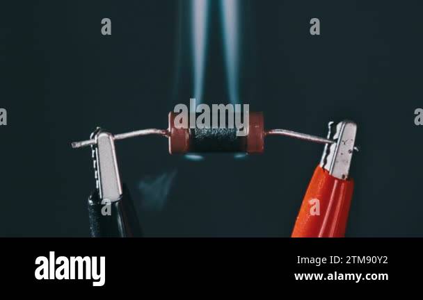 The resistor heats up with smoke under a high current strength, short ...