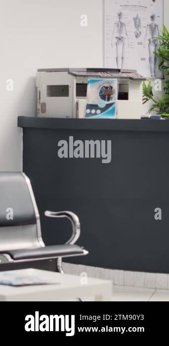 Vertical video: Waiting room lobby at hospital reception, checkup ...