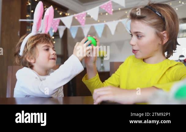 Easter Sunday Family holiday traditions. Two caucasian happy siblings ...