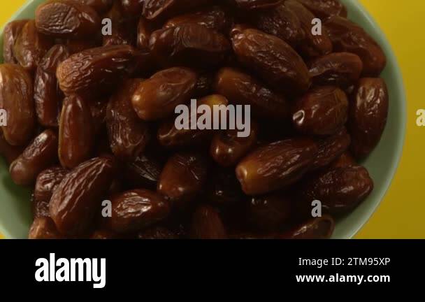 Dates. Dried date palm fruits. Healthy sweet snack food bowl. Pile of ...