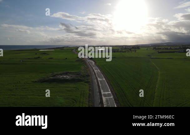 Clouds hung in the interim over the green fields. They portend a ...