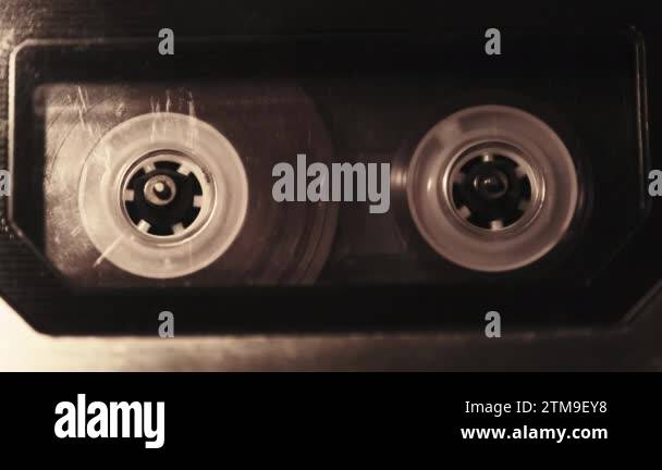 Audiocassette playback in a retro tape recorder. Record player playing ...