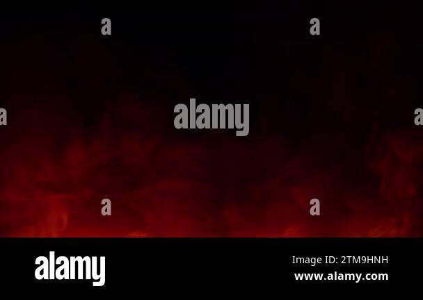 Red smoke with sparks from the fire on the black background with space ...